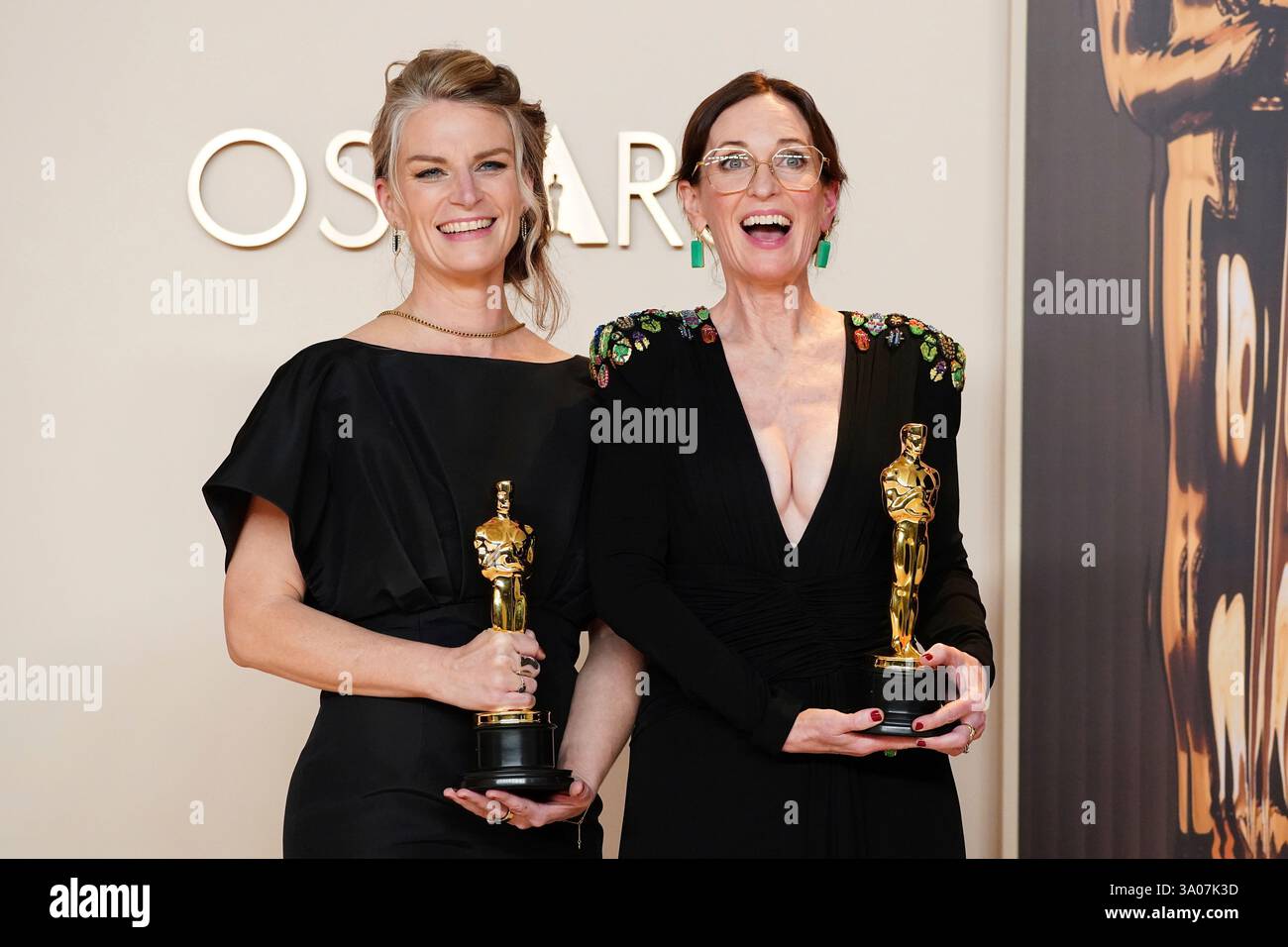 Molly O'Brien, left, and Lisa Remington, winners of the award for best documentary short film ...