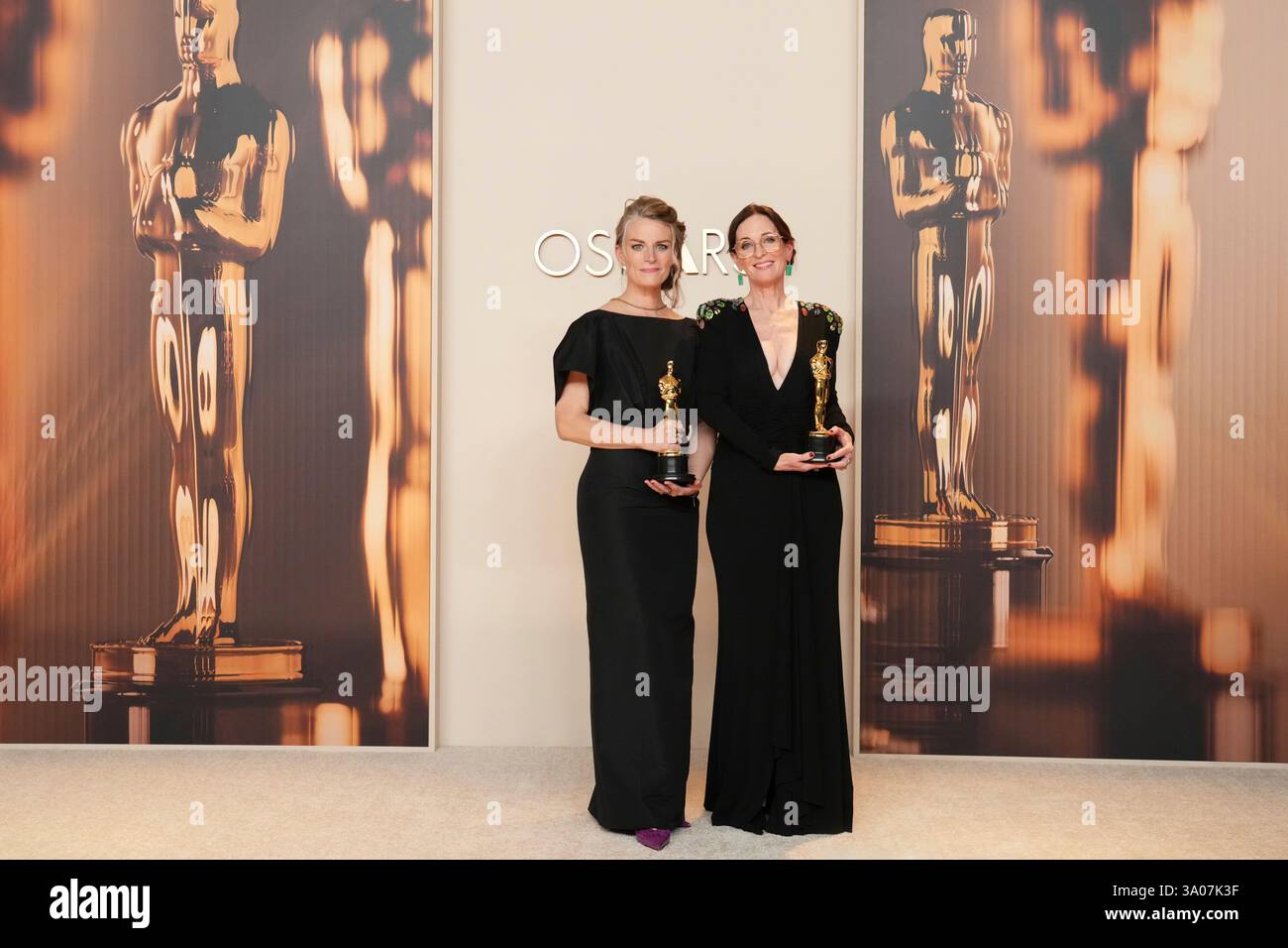 Molly O'Brien, left, and Lisa Remington, winners of the award for best documentary short film ...