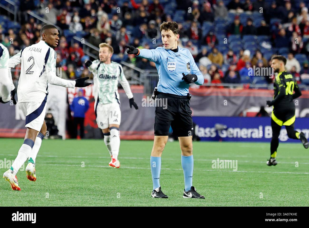 FOXBOROUGH, MA - MARCH 01: Referee Filip Dujic points out an infraction ...