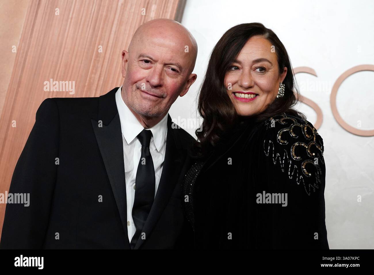 Jacques Audiard, left and Virginie Montel arrive at the Oscars on ...