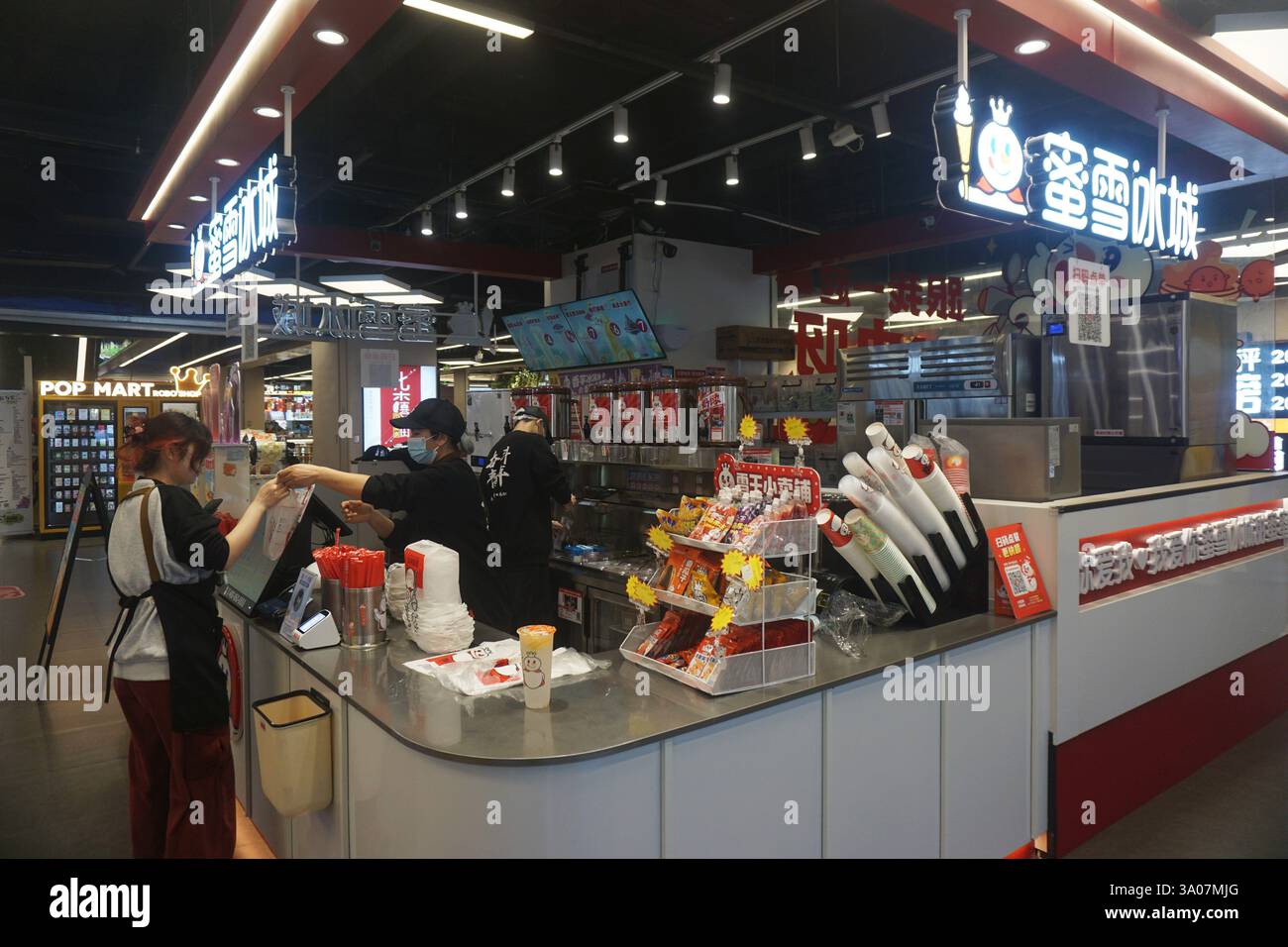 HANGZHOU, CHINA- MARCH 3, 2025 - Customers buy drinks at a MIXUE Ice ...
