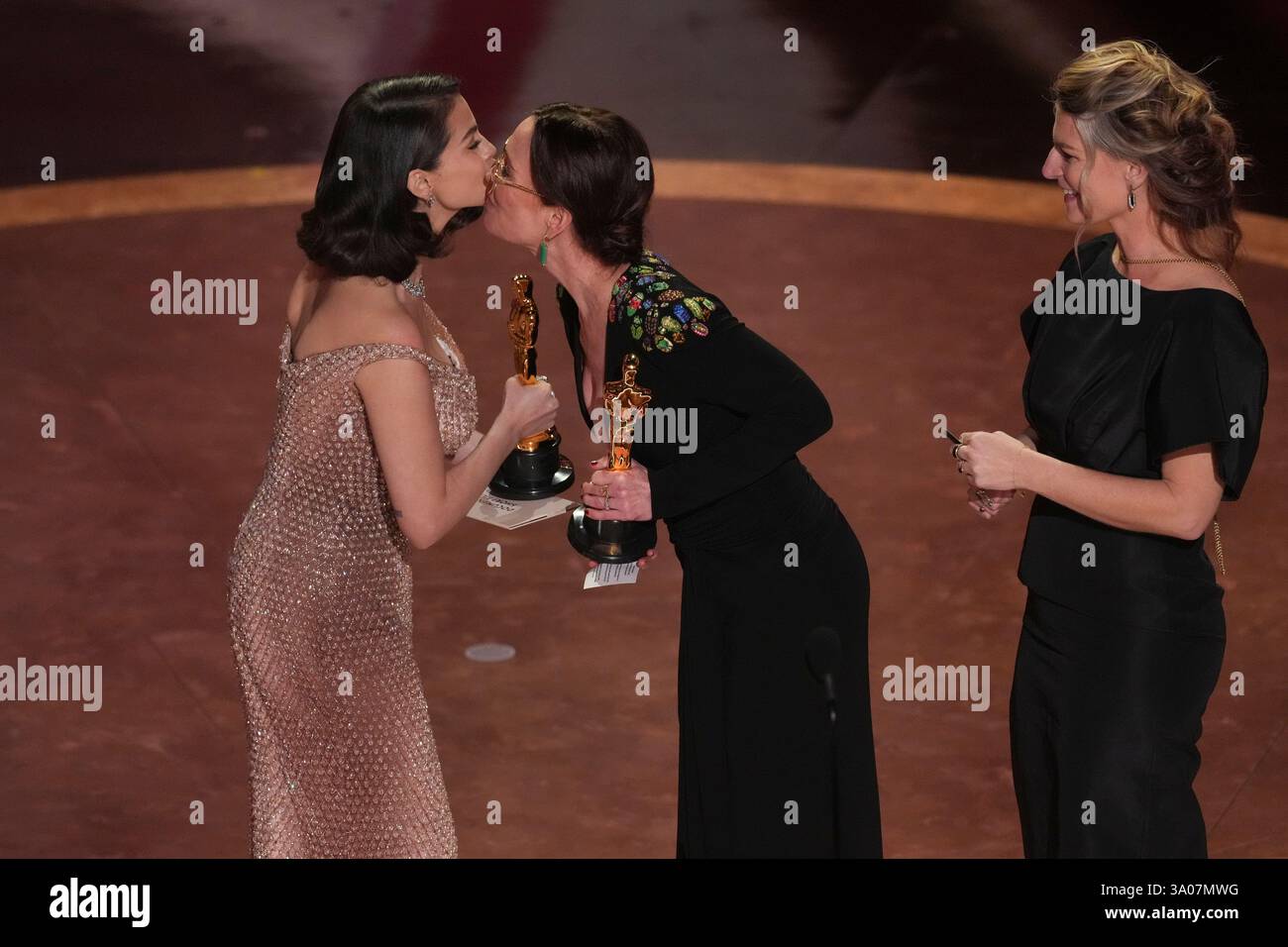 Selena Gomez, from left, presents the award for best documentary short ...