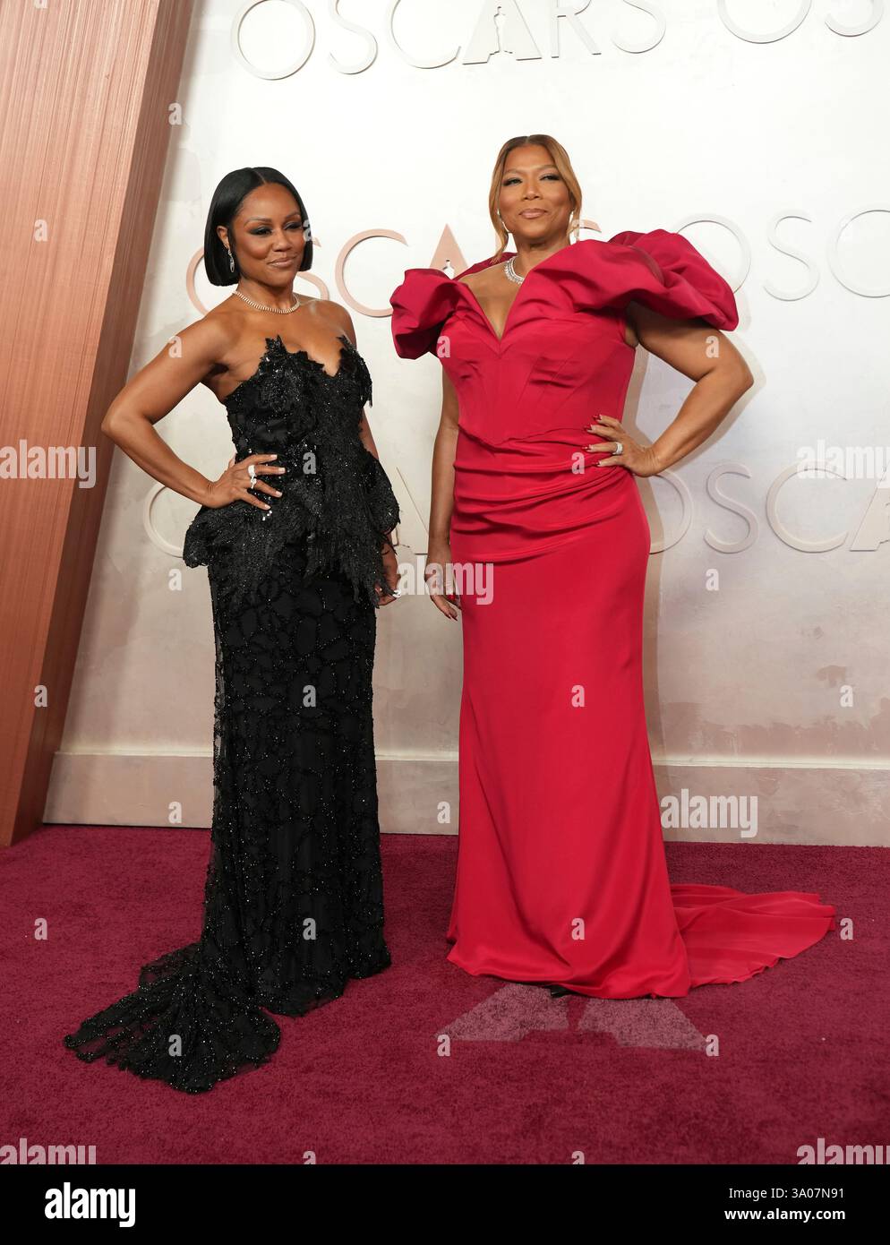 Eboni Nichols, left, and Queen Latifah arrive at the Oscars on Sunday ...