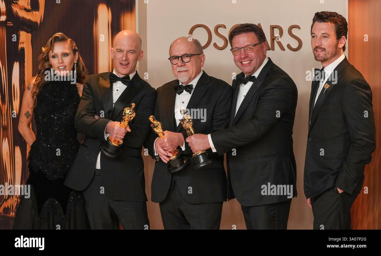 Academy Award presenter Miley Cyrus joins Gareth John, Richard King, Ron Bartlett, and Doug ...