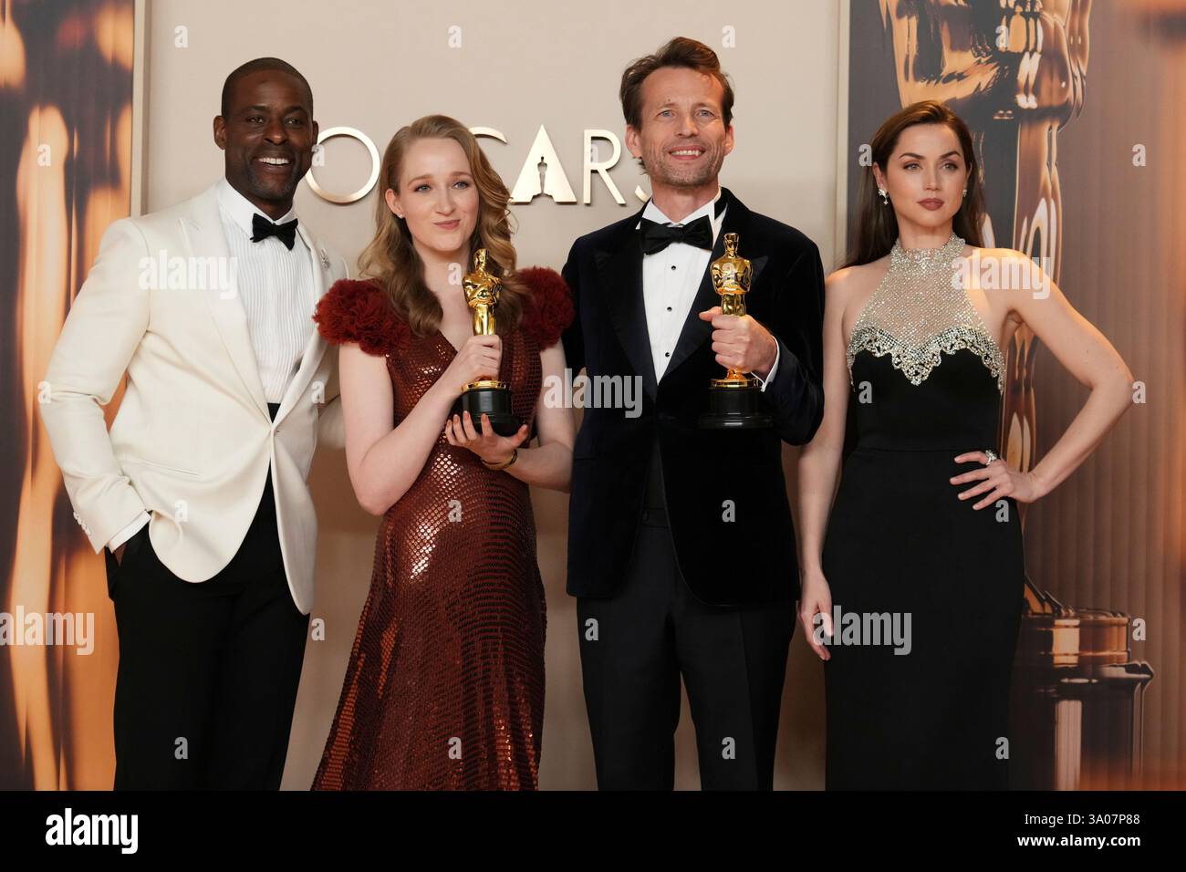 Sterling K. Brown, left, and Ana de Armas pose with Victoria Warmerdam ...