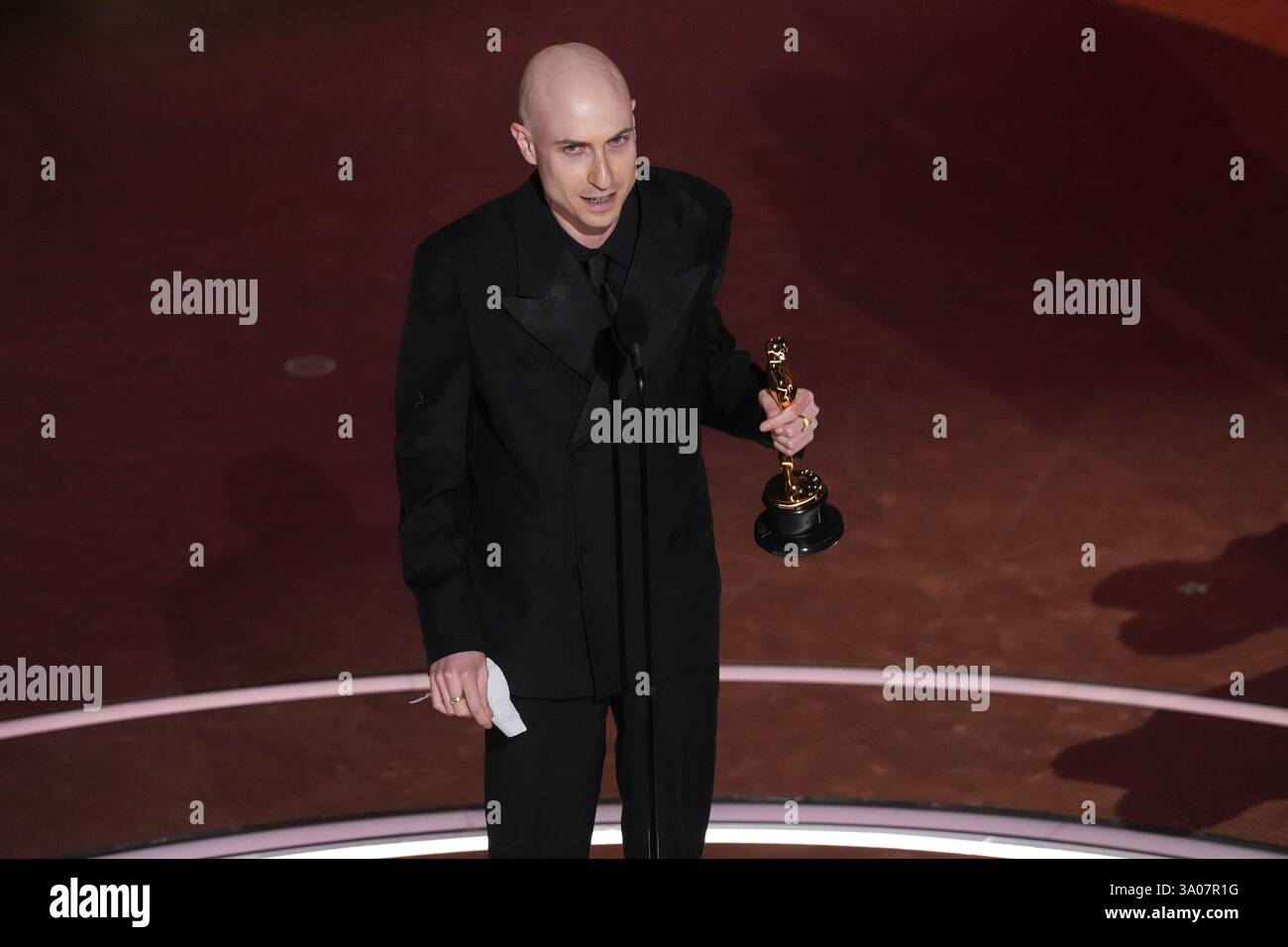 Daniel Blumberg accepts the award for best original score for "The Brutalist" during the Oscars ...