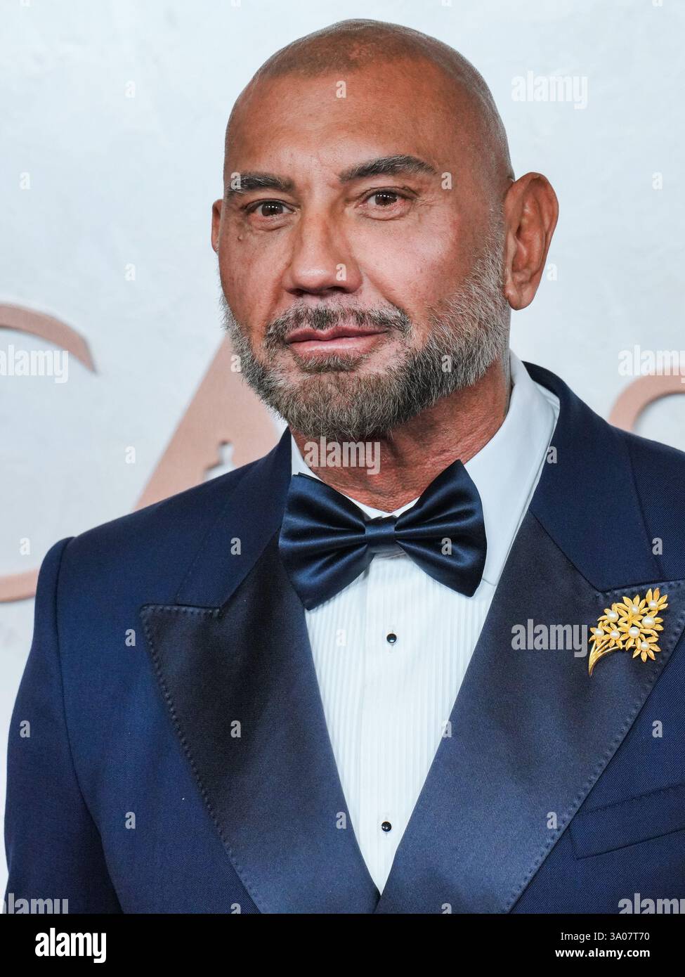 Dave Bautista walking on the red carpet at the The 97th Academy Awards ...