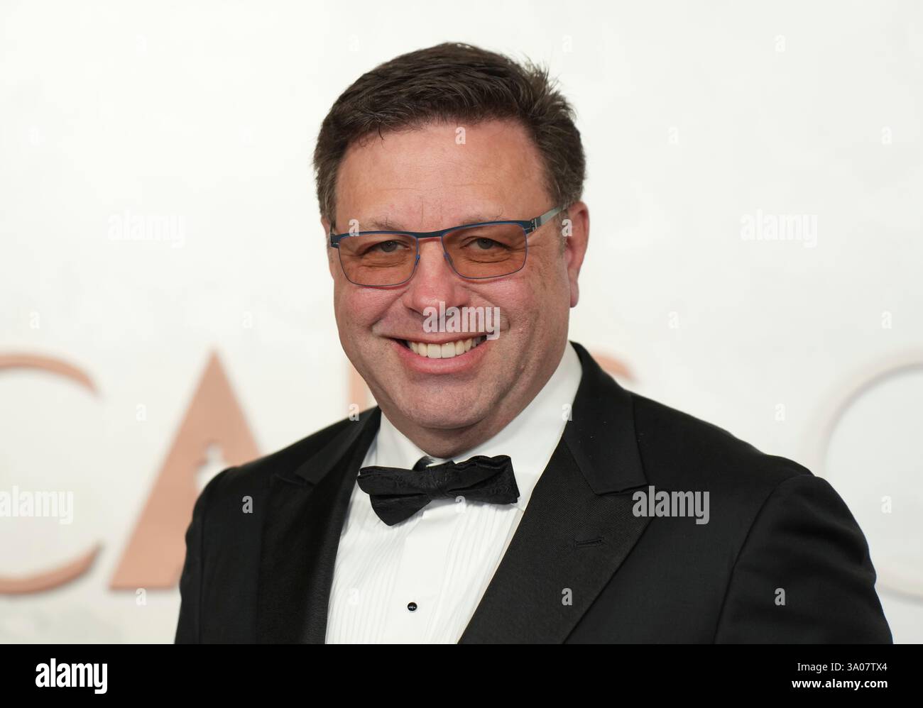 Ron Bartlett arrives at the Oscars on Sunday, March 2, 2025, at the ...