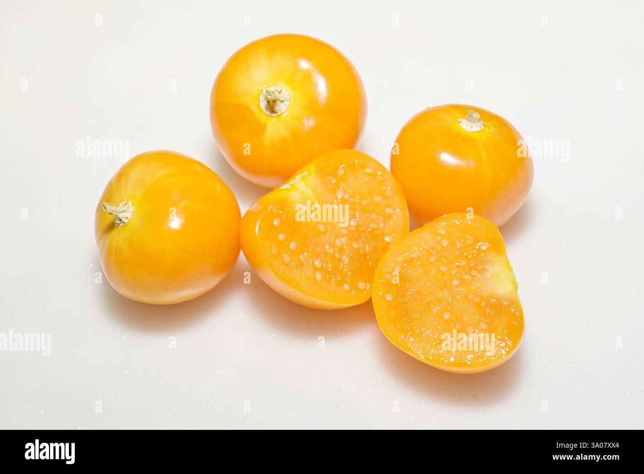 Close-up of yellow cape gooseberry fruits, with exposed and cut berries ...