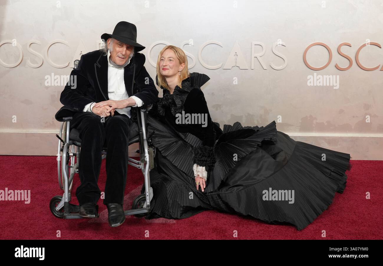 Ed Lachman, left, and Alba Rohrwacher arrive at the Oscars on Sunday ...