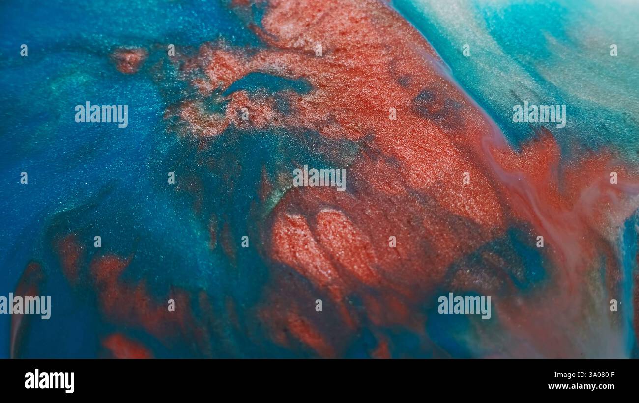 Sparkling ink. Blend wave. Defocused red blue colorful fluid splatter marble texture spreading ...