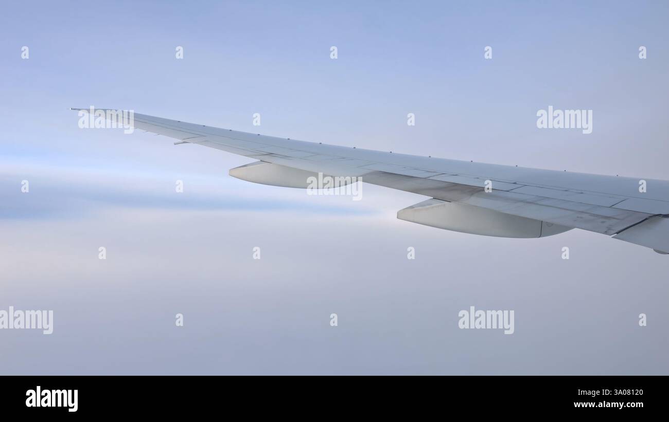 Commercial airplane flying through calm hi-res stock photography and ...