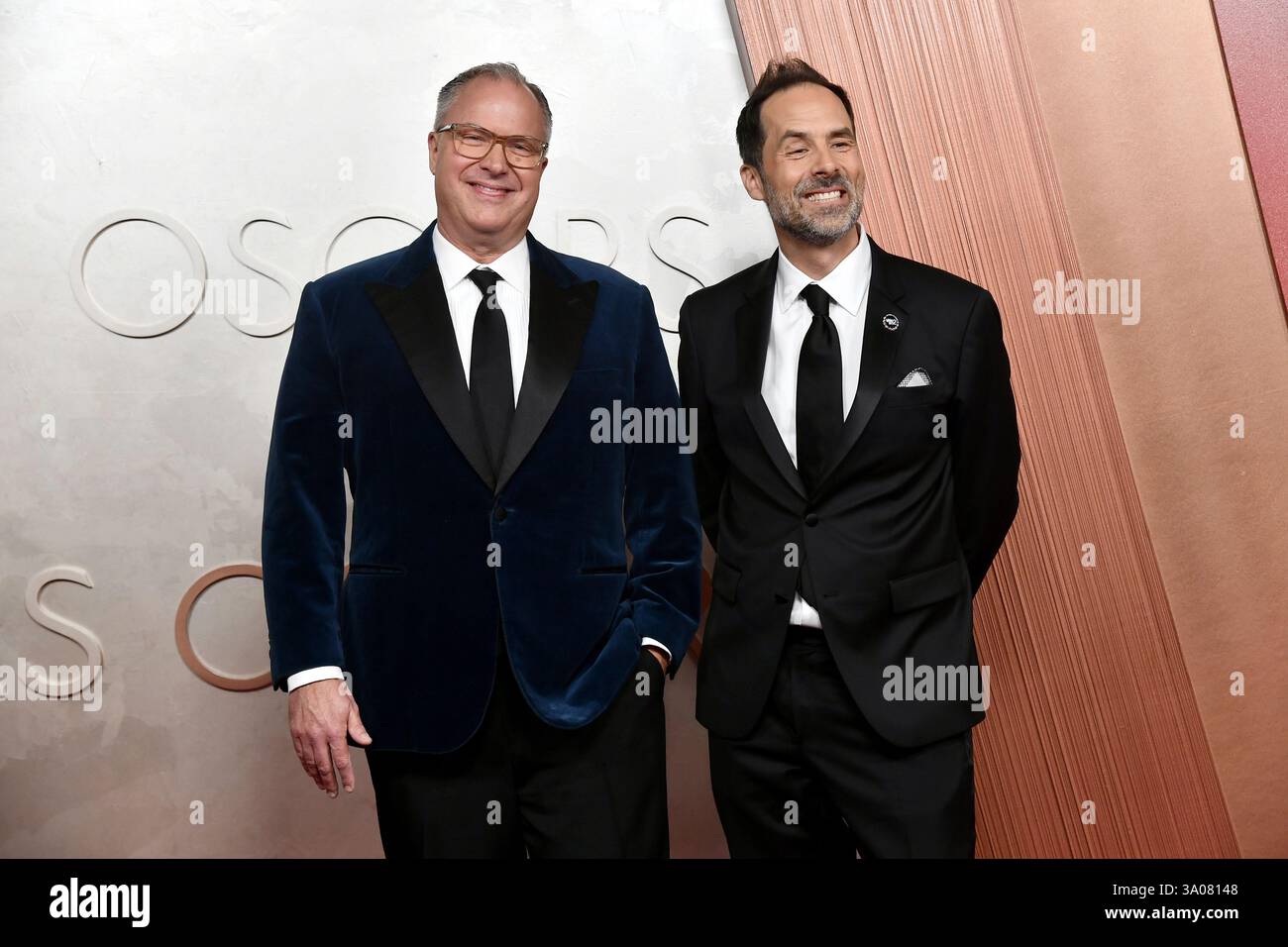 Mark Nielsen, left, and Kelsey Mann arrive at the Oscars on Sunday ...