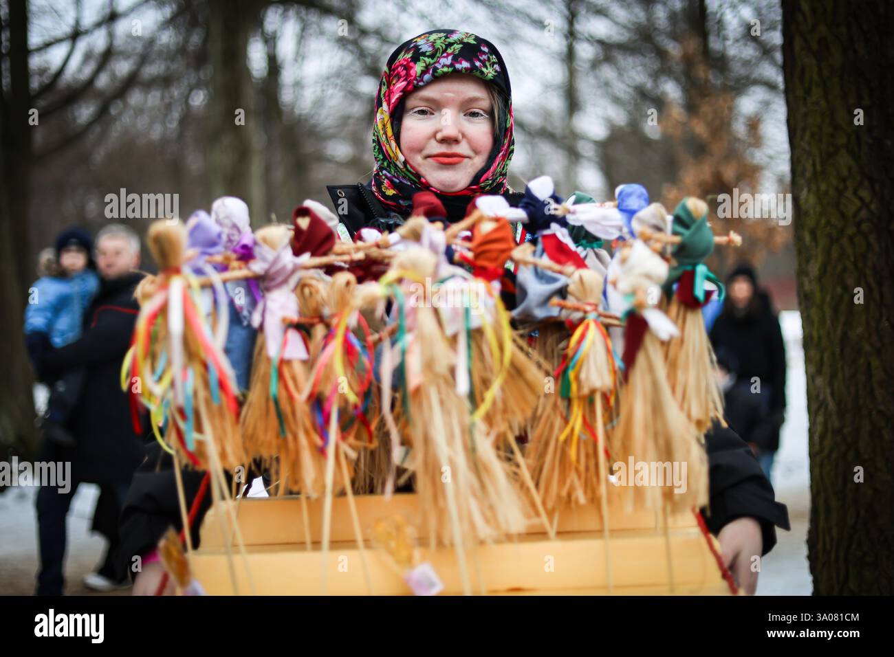 A girl in traditional Russian folk costume with the main symbol of the ...