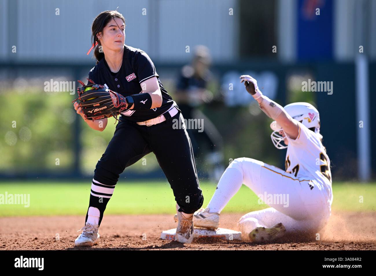 Troy infielder Makaley Boswell, left, gets the force out on Western ...
