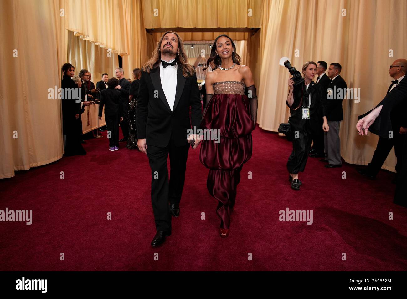 Marco Perego-Saldana, left, and Zoe Saldana arrive at the Oscars on ...