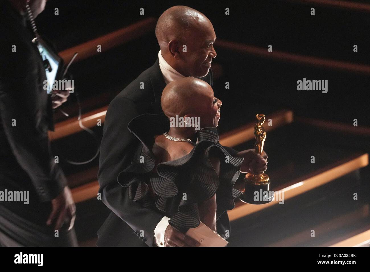 Cynthia Erivo, left, embraces Paul Tazewell, winner of the award for ...
