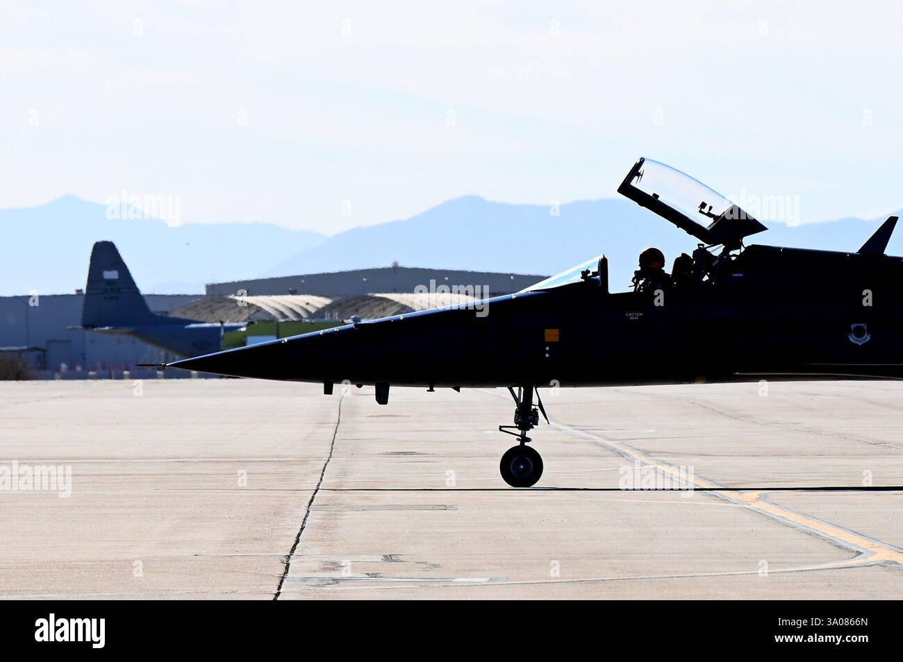 A U.S. Air Force F-5 Tiger aircraft raises its canopy before taxing ...