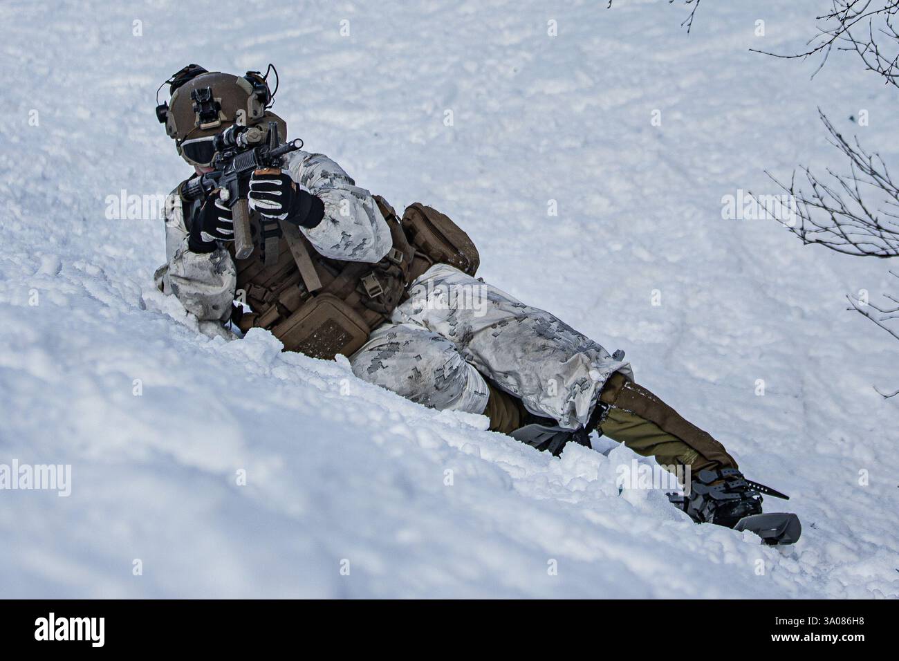 A U.S. Marine with 2d Battalion, 8th Marines, 2d Marine Division aims ...