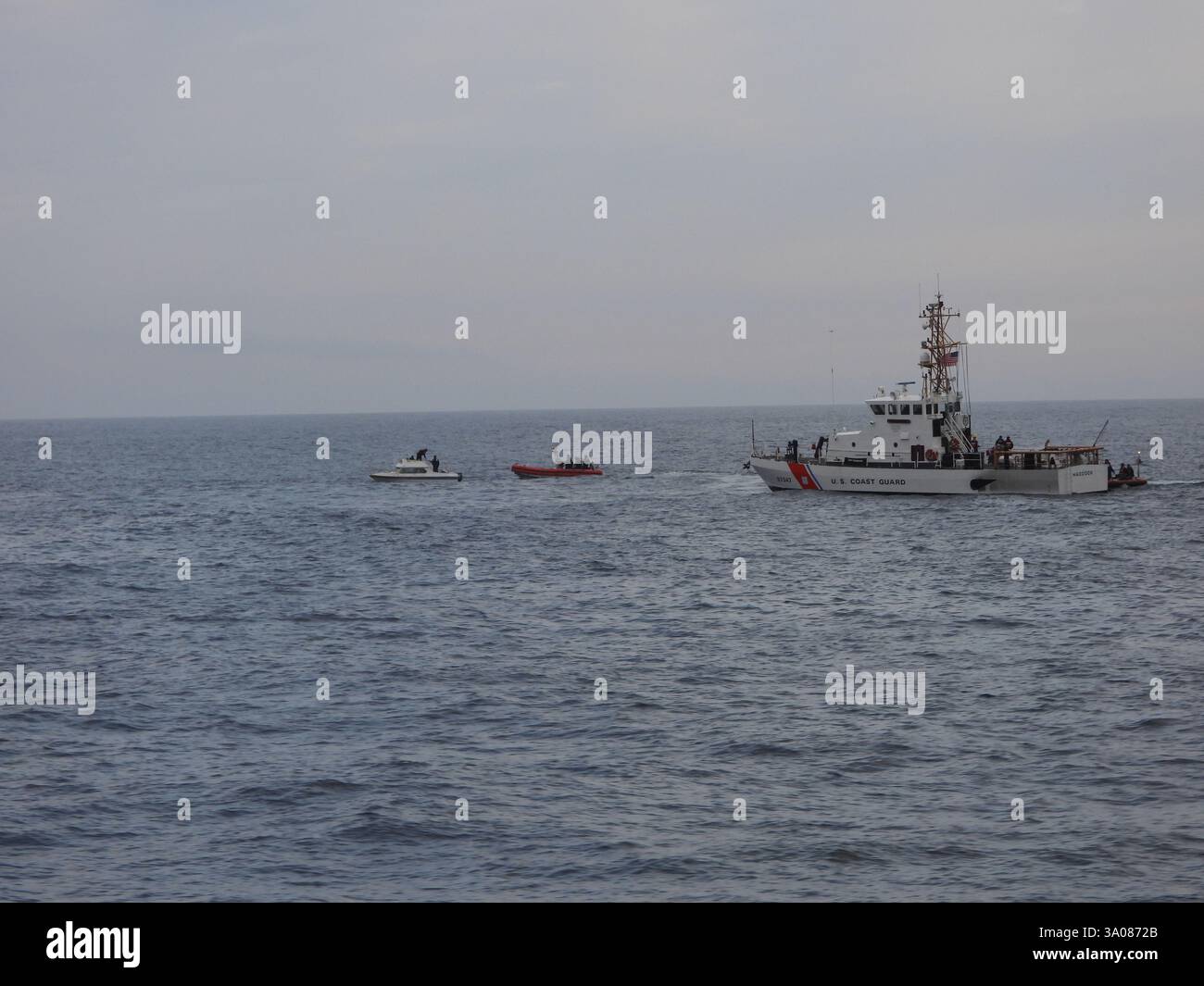The crews of the Coast Guard Cutter Haddock and Cutter Forest Rednour ...