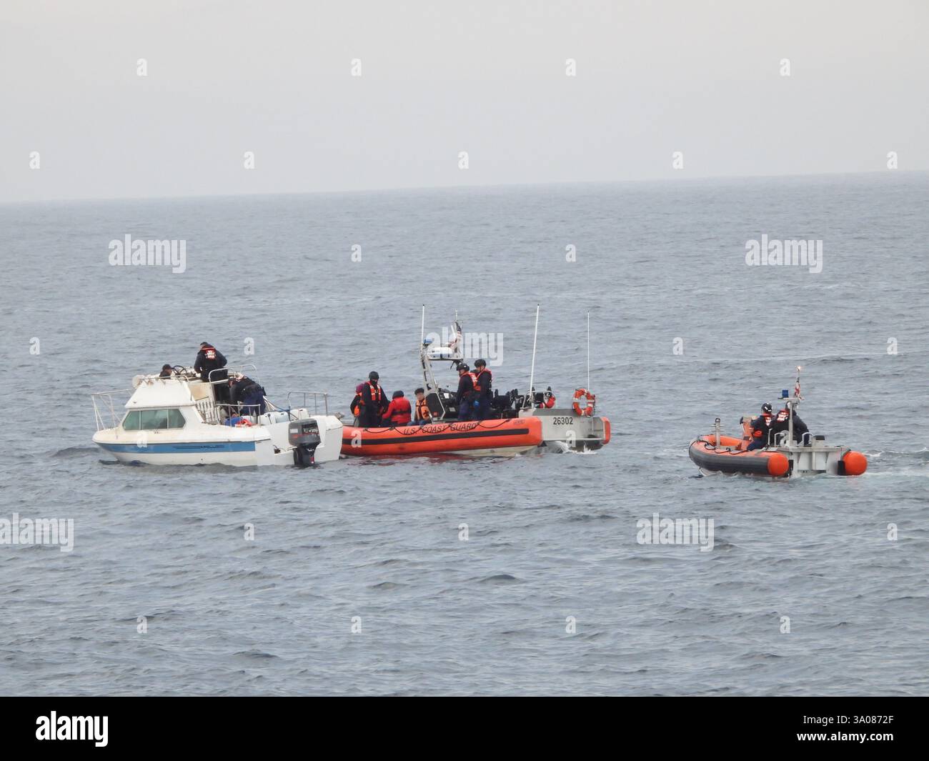 The crews of the Coast Guard Cutter Haddock and Cutter Forest Rednour ...