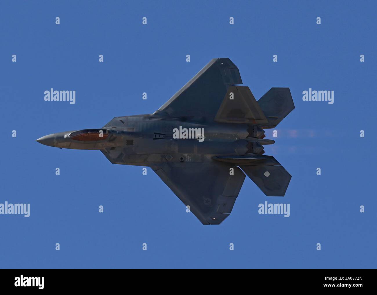 A U.S. Air Force F-22 Raptor aircraft demonstrates aerial capabilities ...