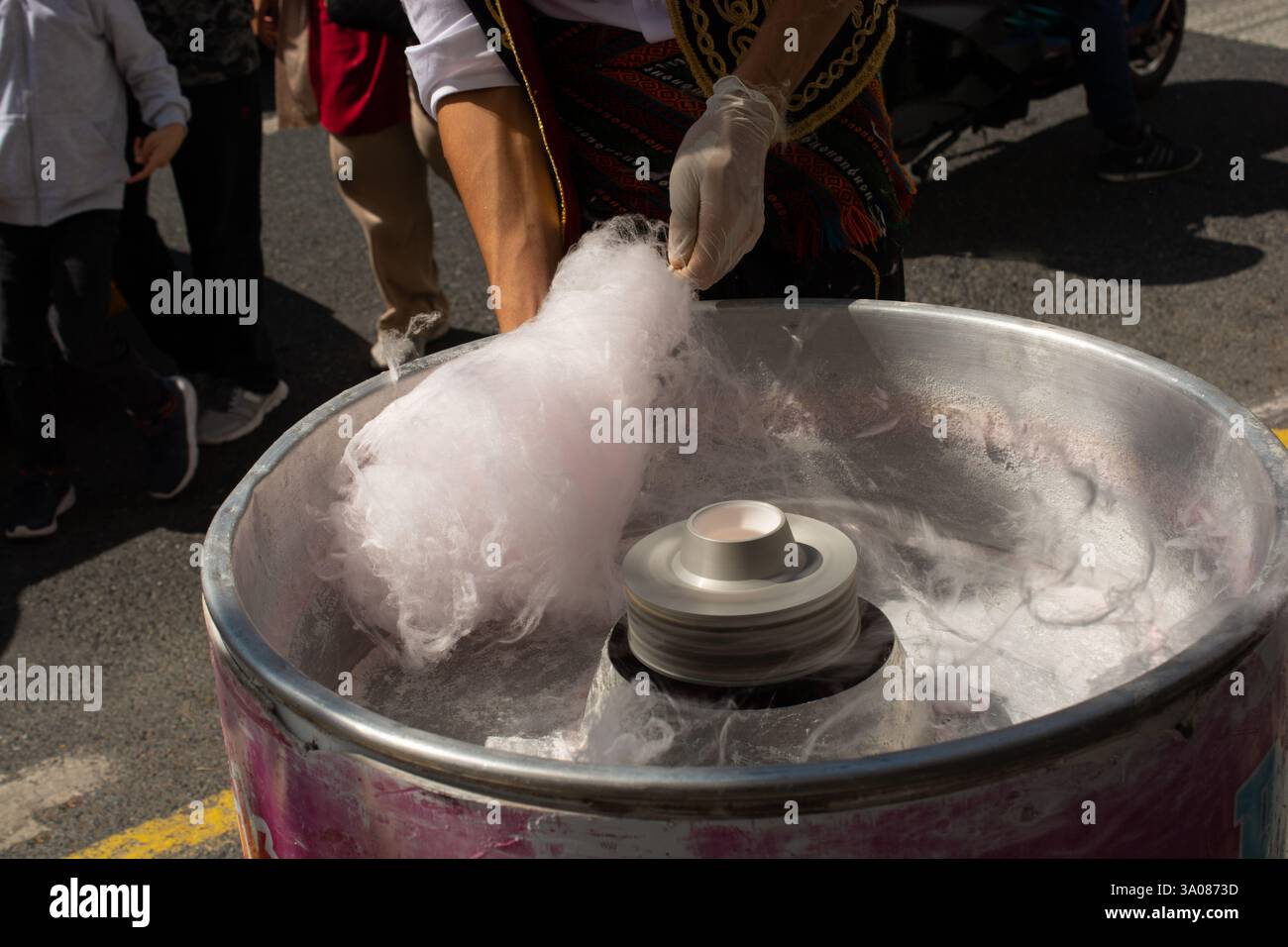 The process of making sweet cotton candy at a street market. Street ...