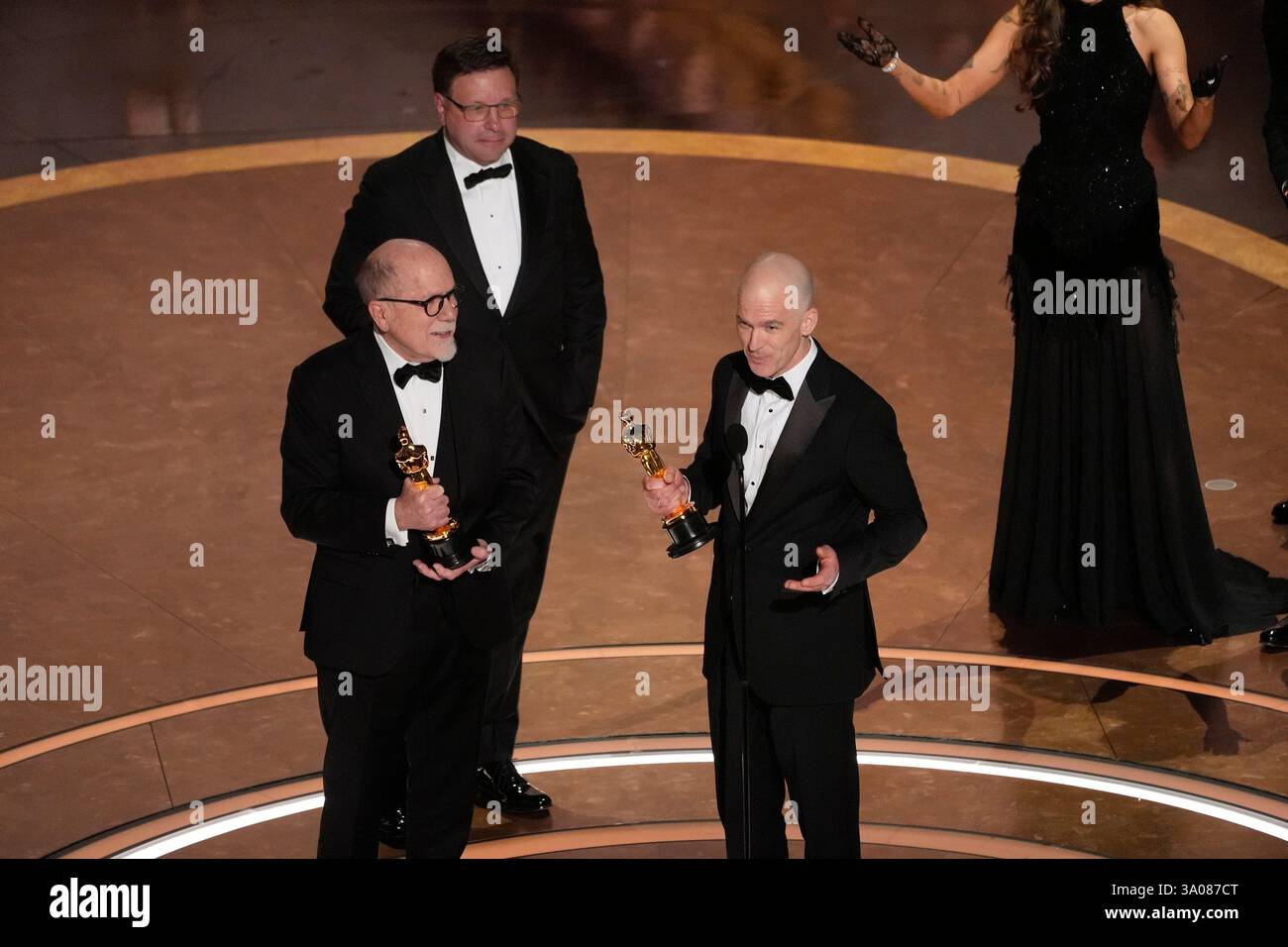 Richard King from left, Ron Bartlett, and Gareth John accept the award ...
