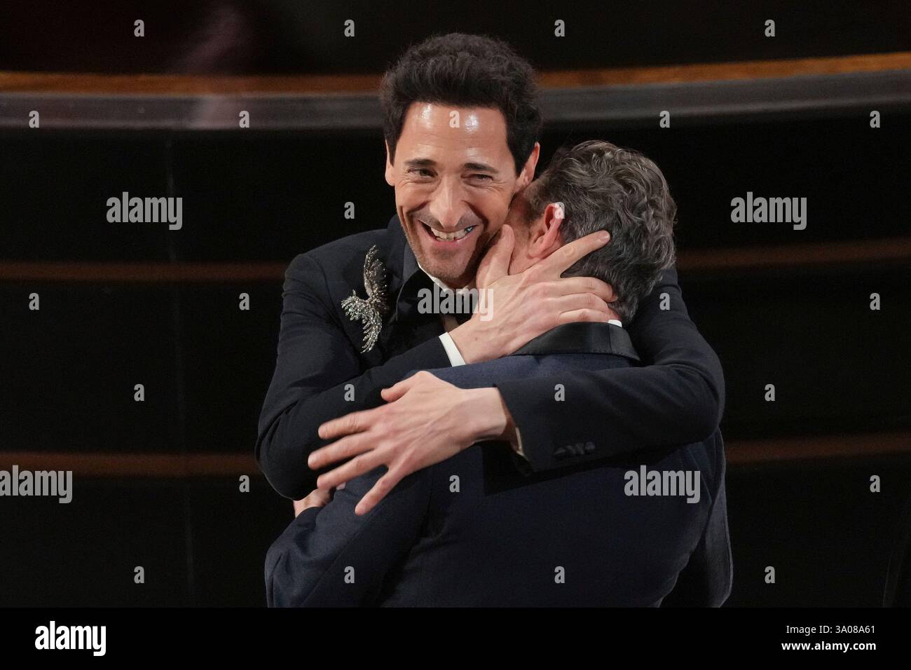 Adrien Brody, left, hugs Lol Crawley for winning the award for best cinematography for "The ...