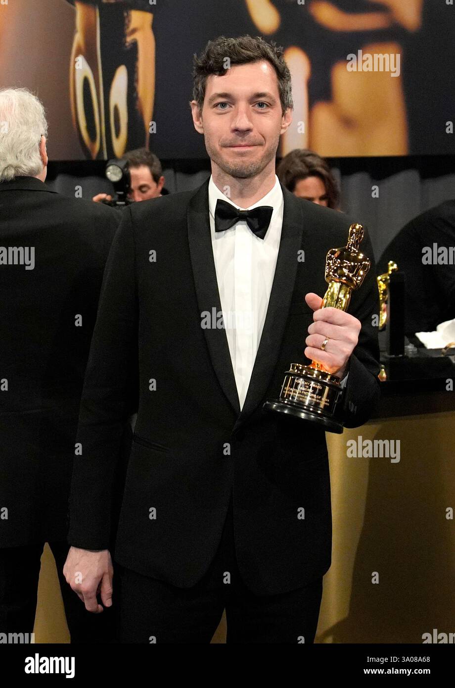 Alex Coco, winner of the award for best picture for "Anora," attends ...