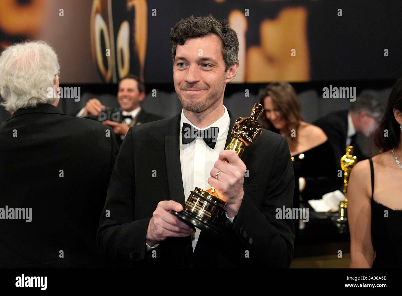 Alex Coco, winner of the award for best picture for "Anora," attends ...