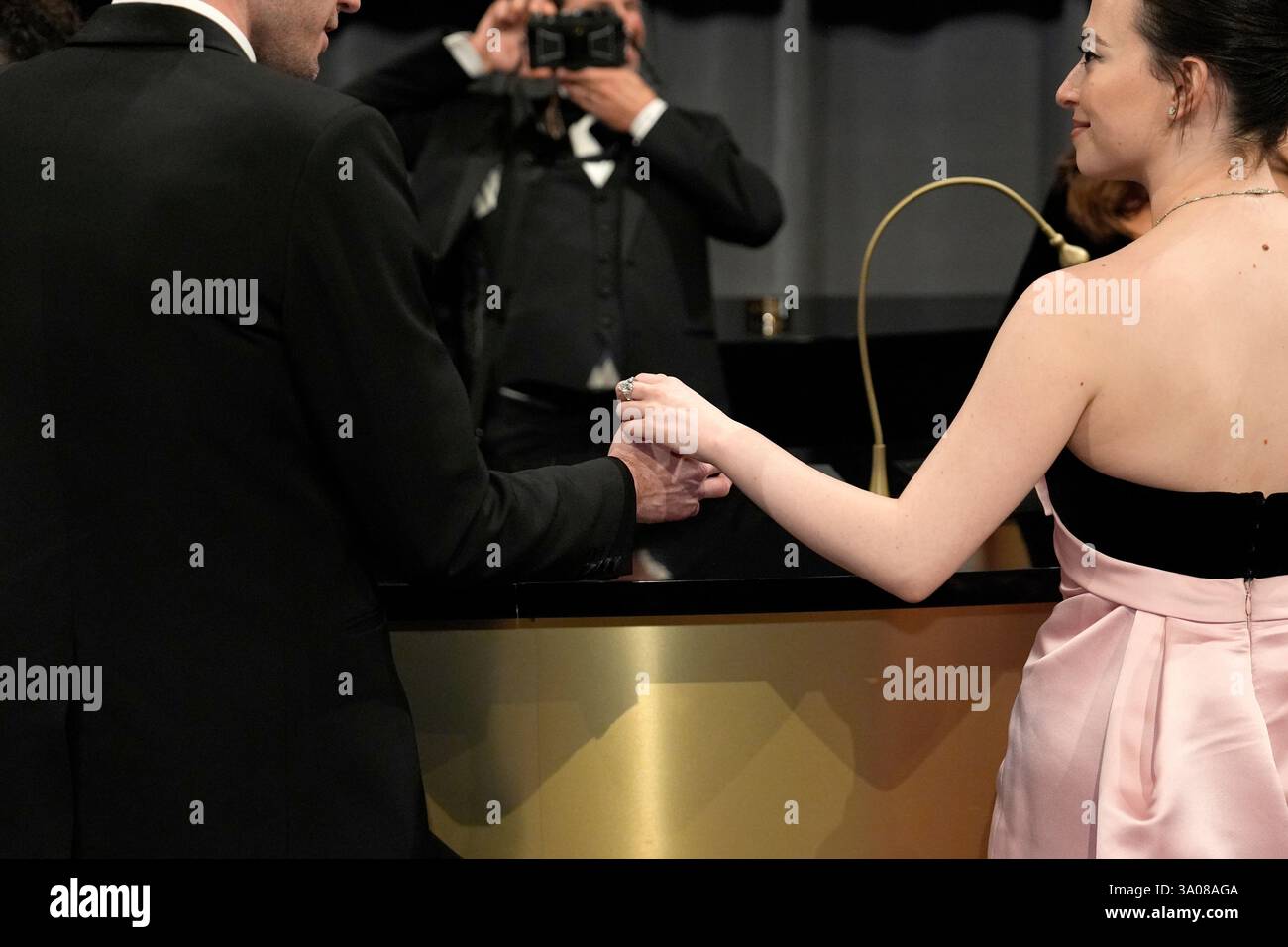 Alex Coco, left, winner of the award for best picture for "Anora," and ...