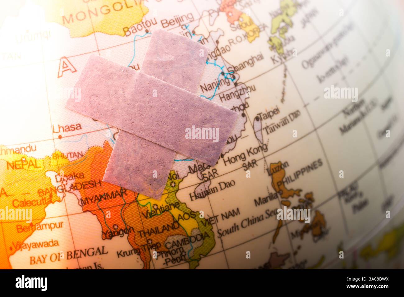 Adhesive plaster on an Earth globe in the view Stock Photo - Alamy