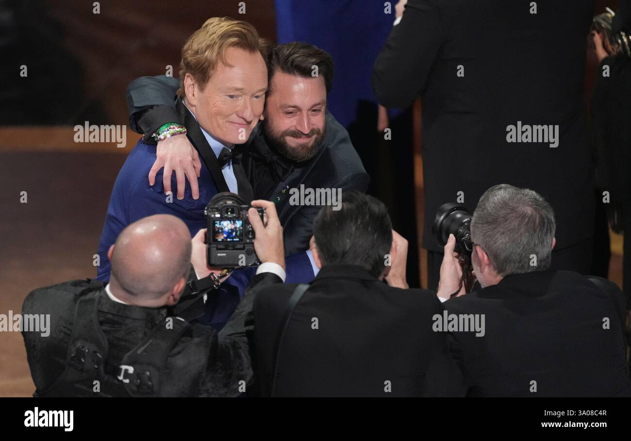 Conan O'Brien, left and Kieran Culkin in the audience during the Oscars ...