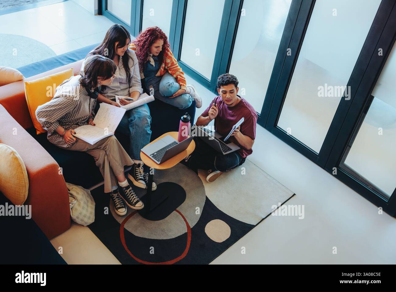 Diverse group of students engaged in an informal study session in a ...