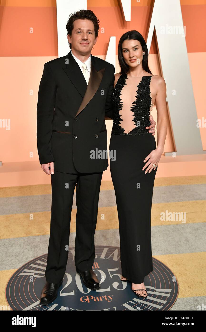 Charlie Puth, left, and Brooke Sansone arrive at the Vanity Fair Oscar ...