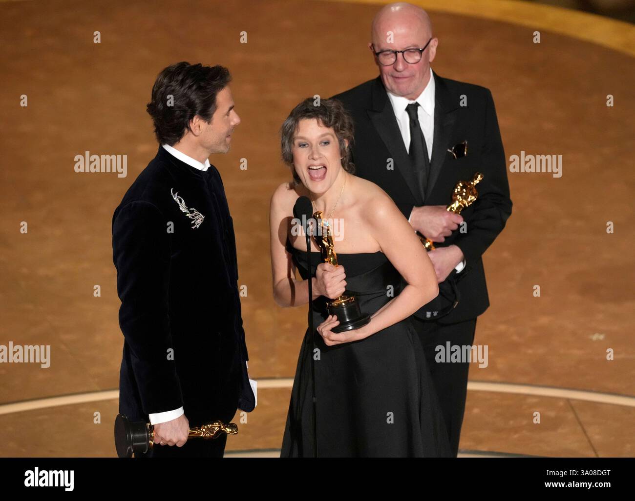 Clement Ducol, from left, Camille, and Jacques Audiard accept the award ...