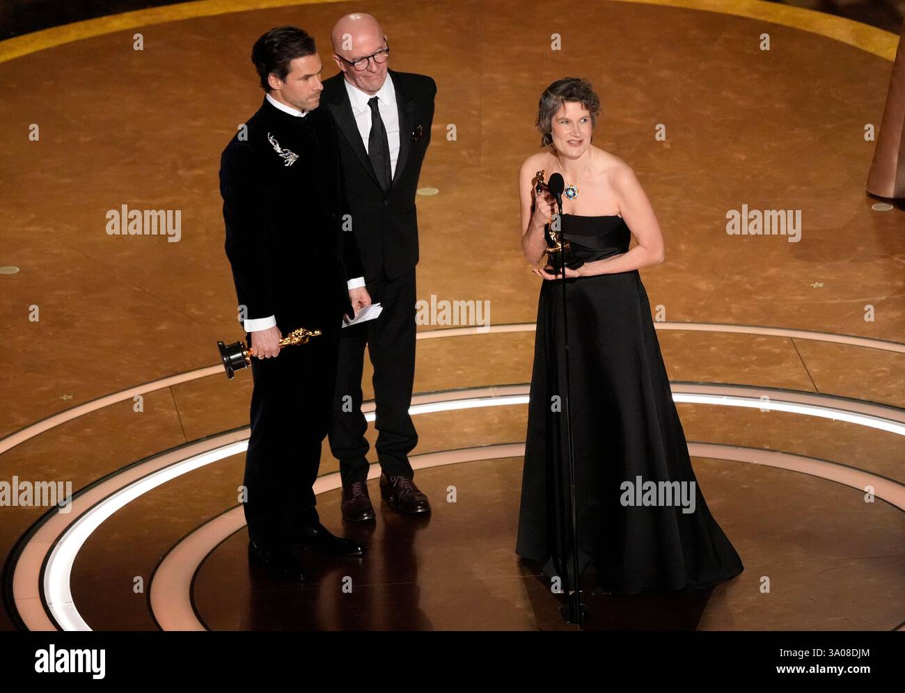 Clement Ducol, from left, Jacques Audiard, and Camille accept the award ...