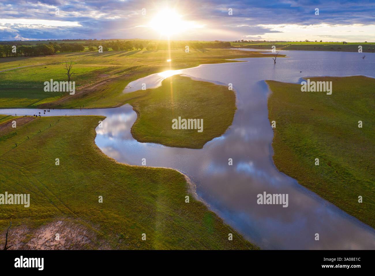 Aerial view of sunset over a drying lake at Cairn Curran Reservoir in ...