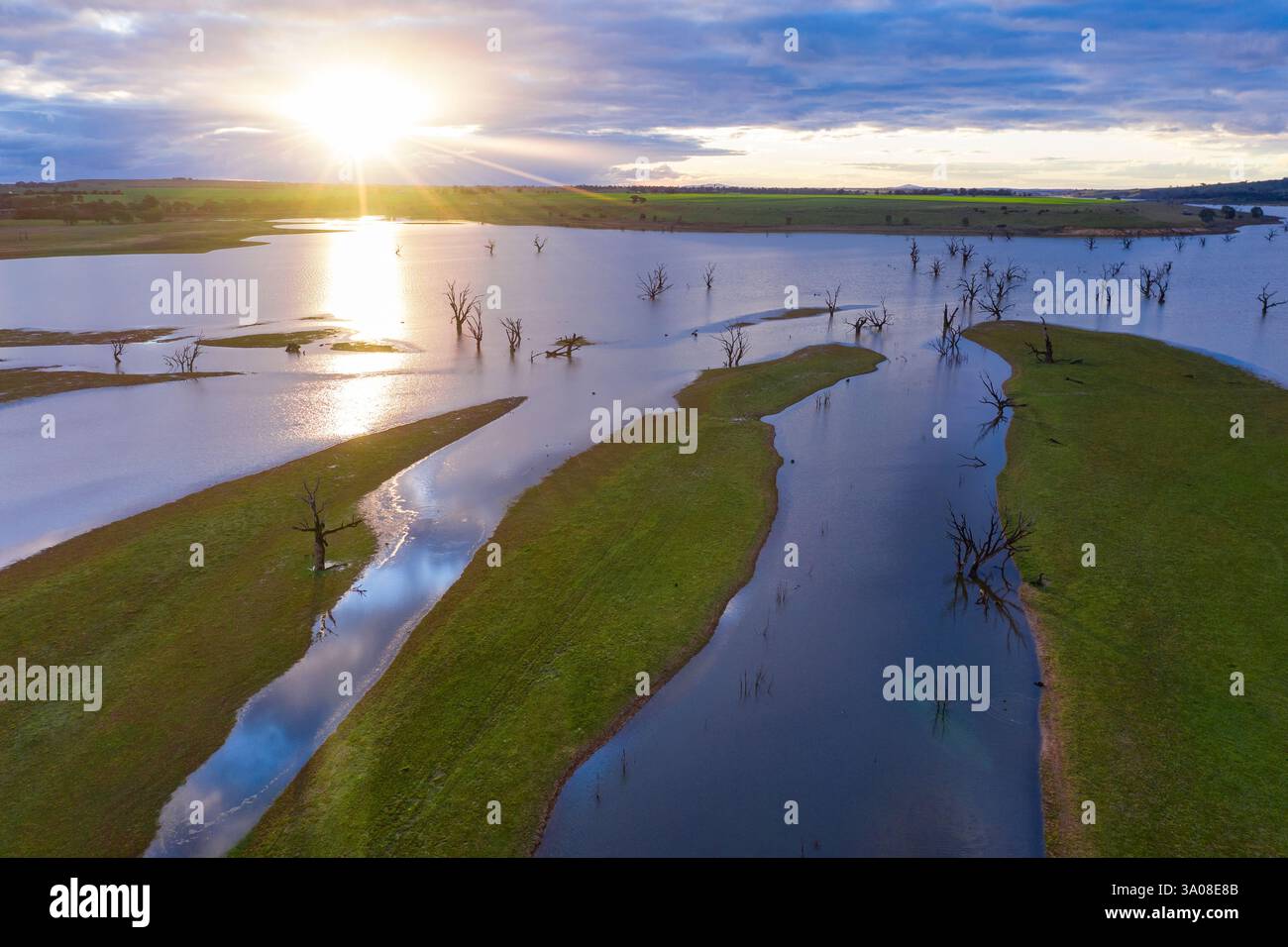 Aerial view of sunset over a drying lake at Cairn Curran Reservoir in ...