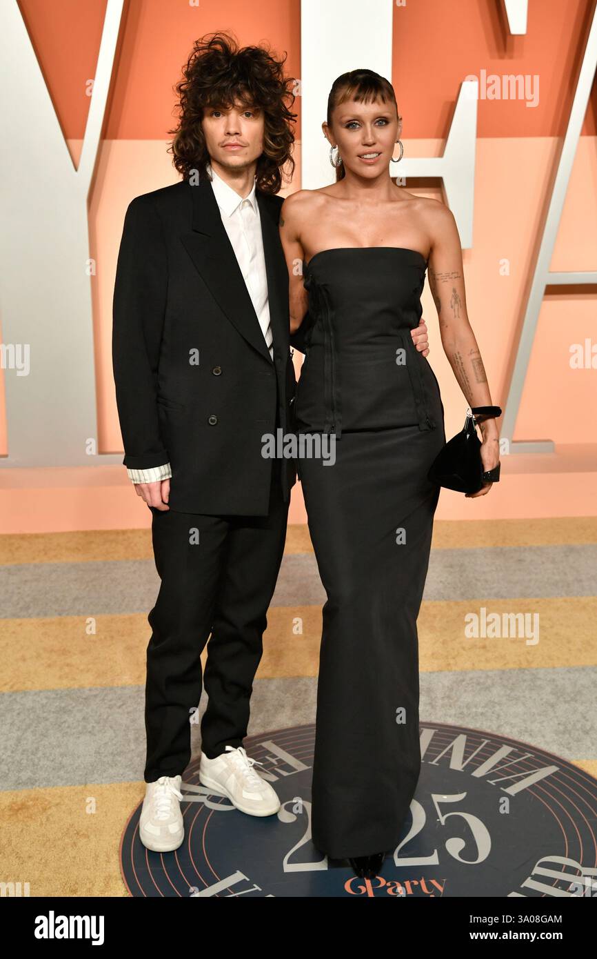 Maxx Morando and Miley Cyrus arrive at the Vanity Fair Oscar Party on ...