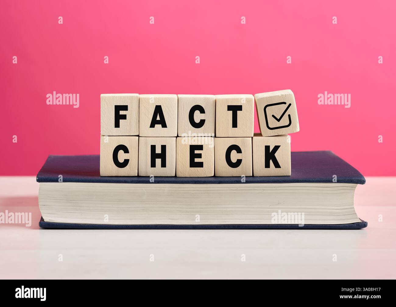 Fact check concept featuring wooden cubes alongside a check mark ...