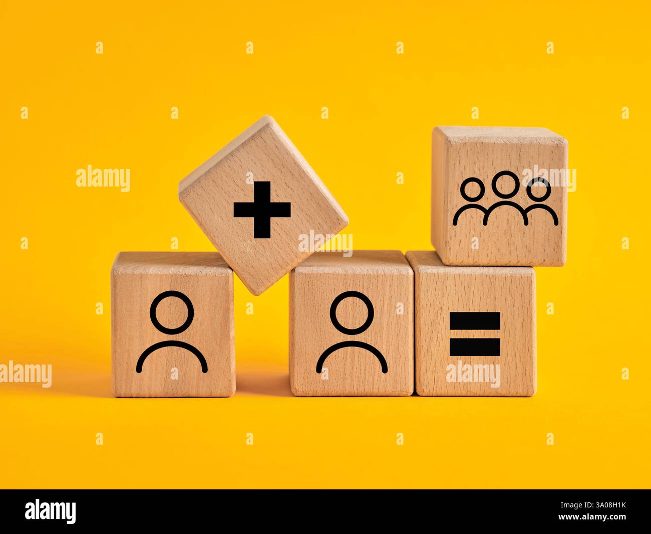 Wooden cubes representing individual persons and their sum resulting in ...