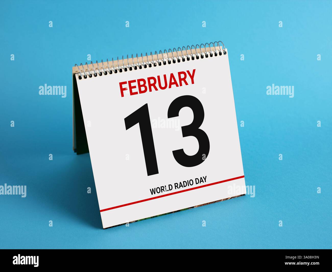 White desktop calendar displaying February 13 as World Radio Day ...
