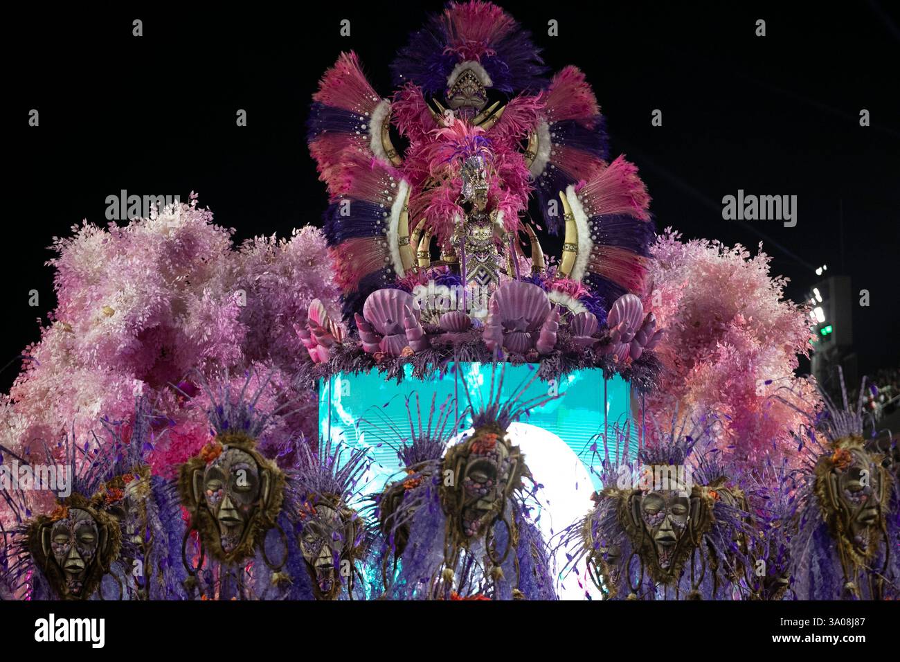Performers from the Mangueira samba school parade on a float during ...