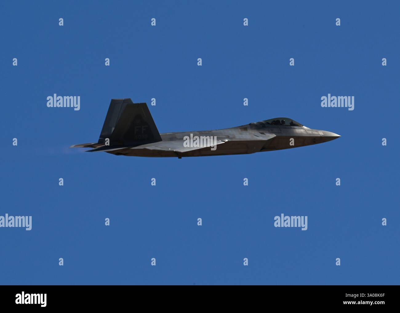 A U.S. Air Force F-22 Raptor aircraft speeds by during the Heritage ...