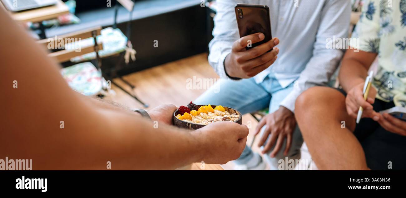 Chef showing healthy bowl to food bloggers and influencers taking ...