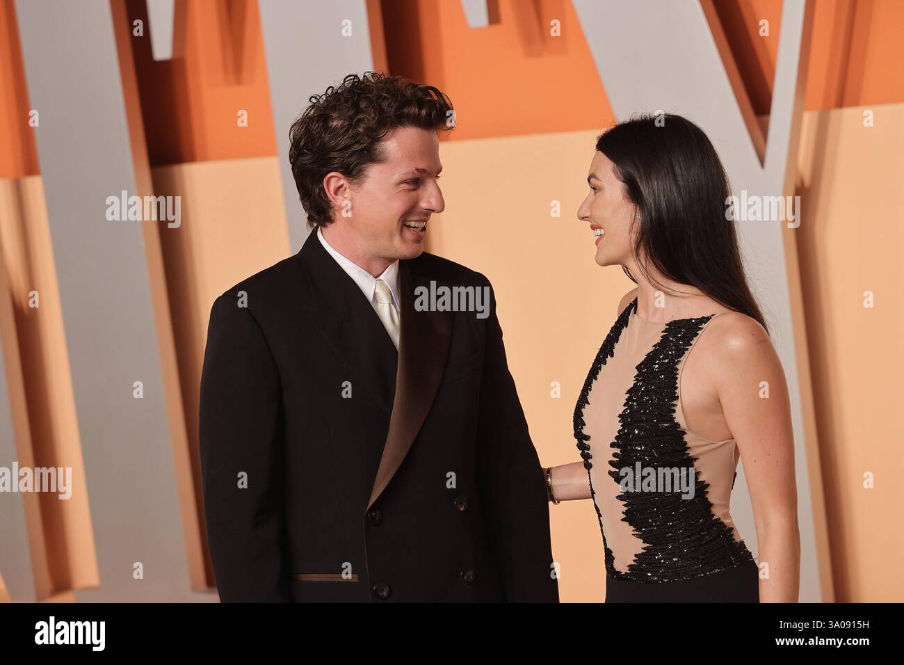 Charlie Puth, Brooke Sansone attend the 2025 Vanity Fair Oscar Party at ...