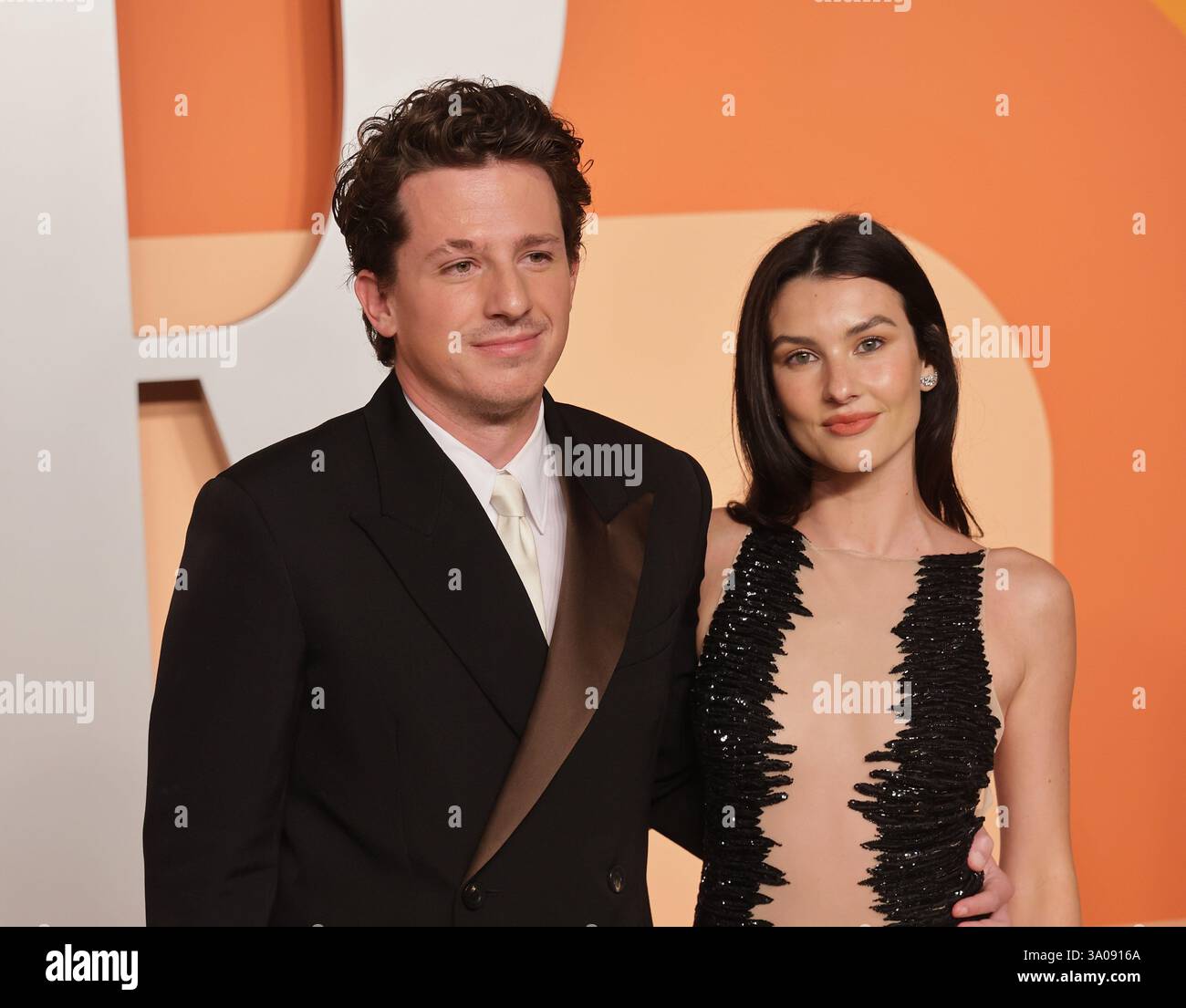 Charlie Puth, Brooke Sansone attend the 2025 Vanity Fair Oscar Party at ...