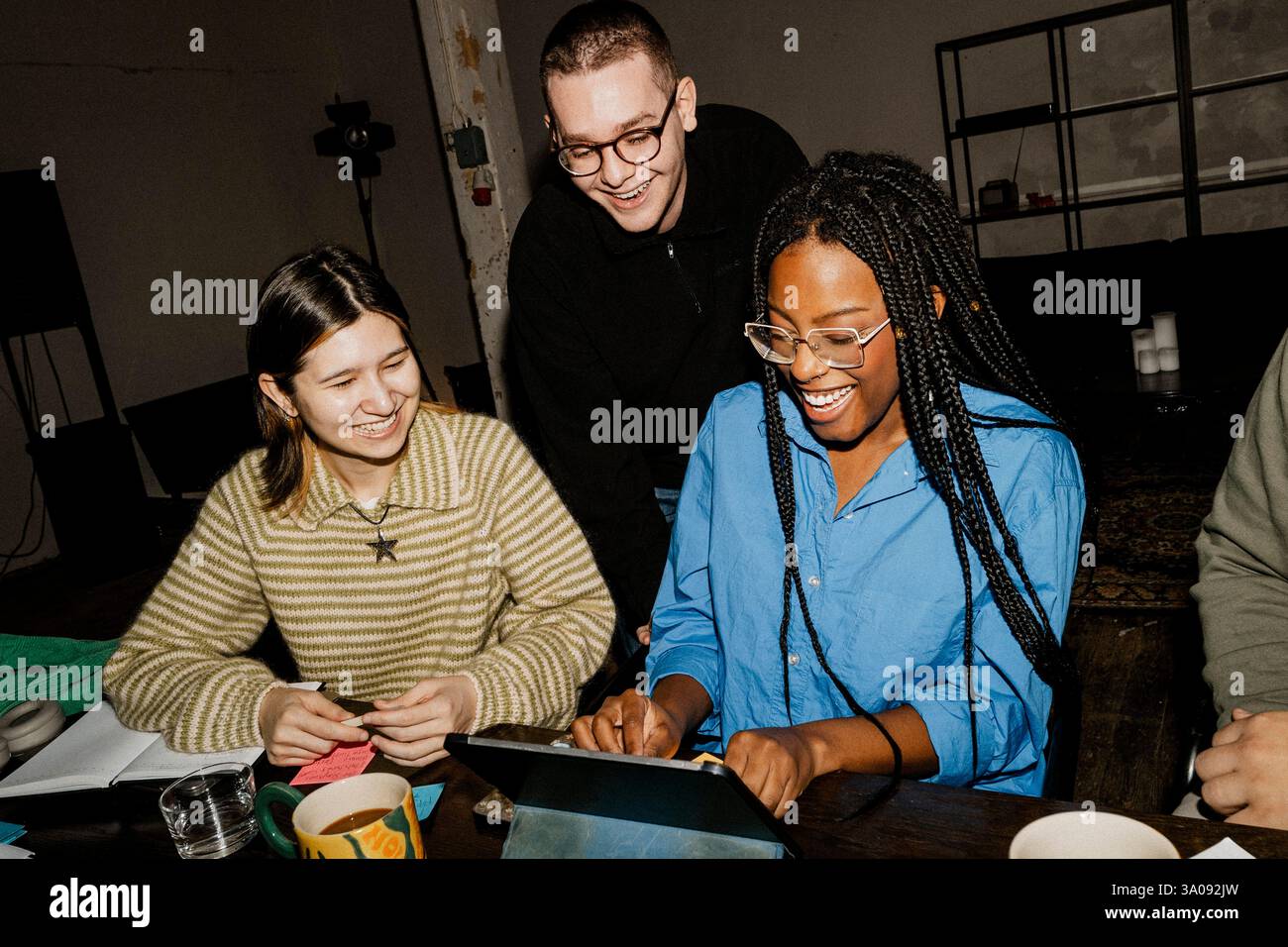 Happy multiracial male and female business professionals working ...